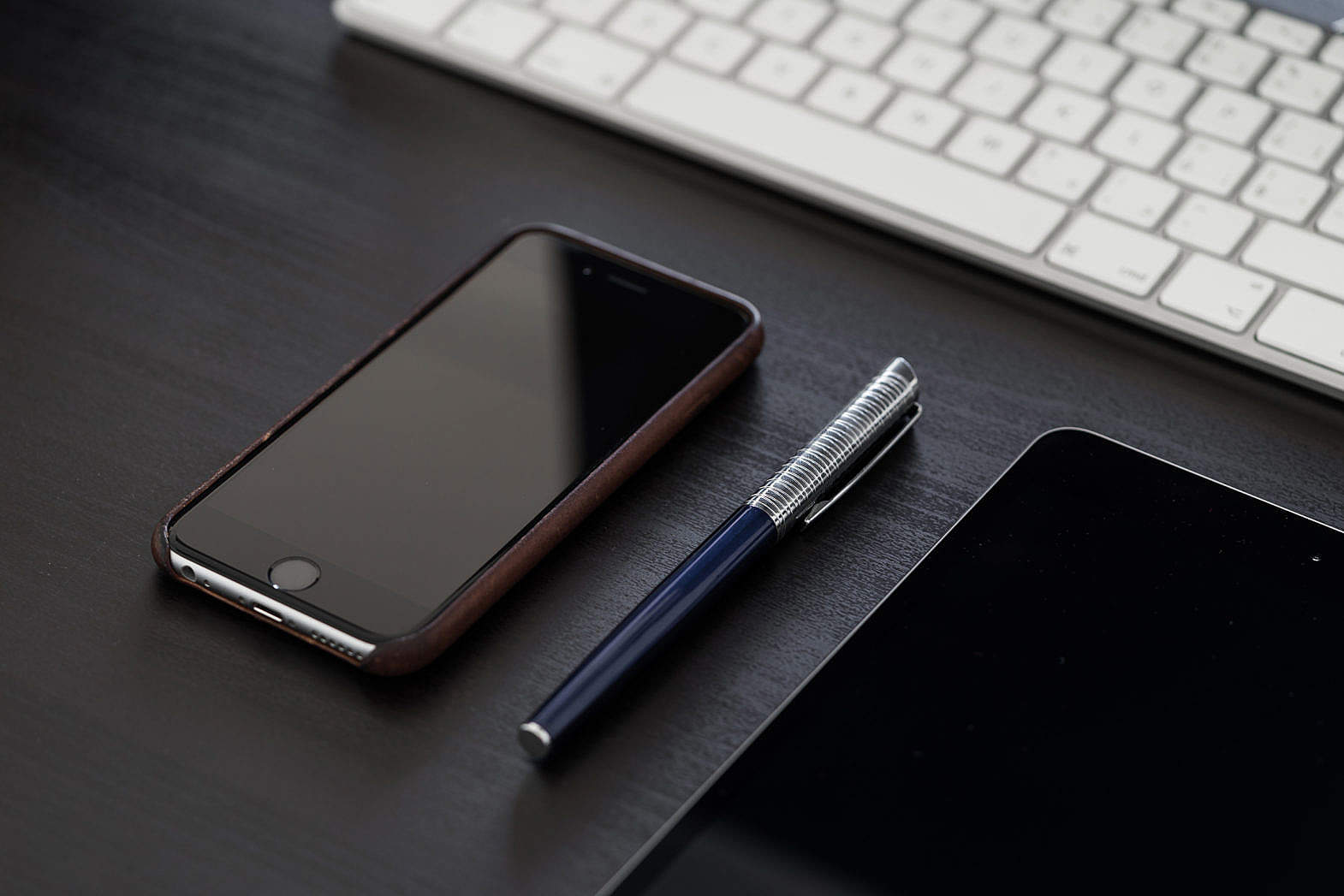 Black iPhone on Black Office Desk Free Stock Photo | picjumbo