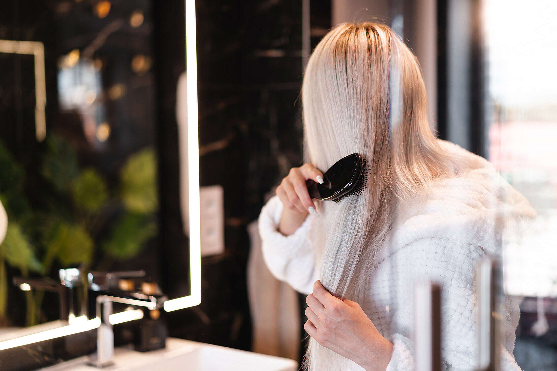 Blonde Woman Brushing Her Hair Free Stock Photo | picjumbo