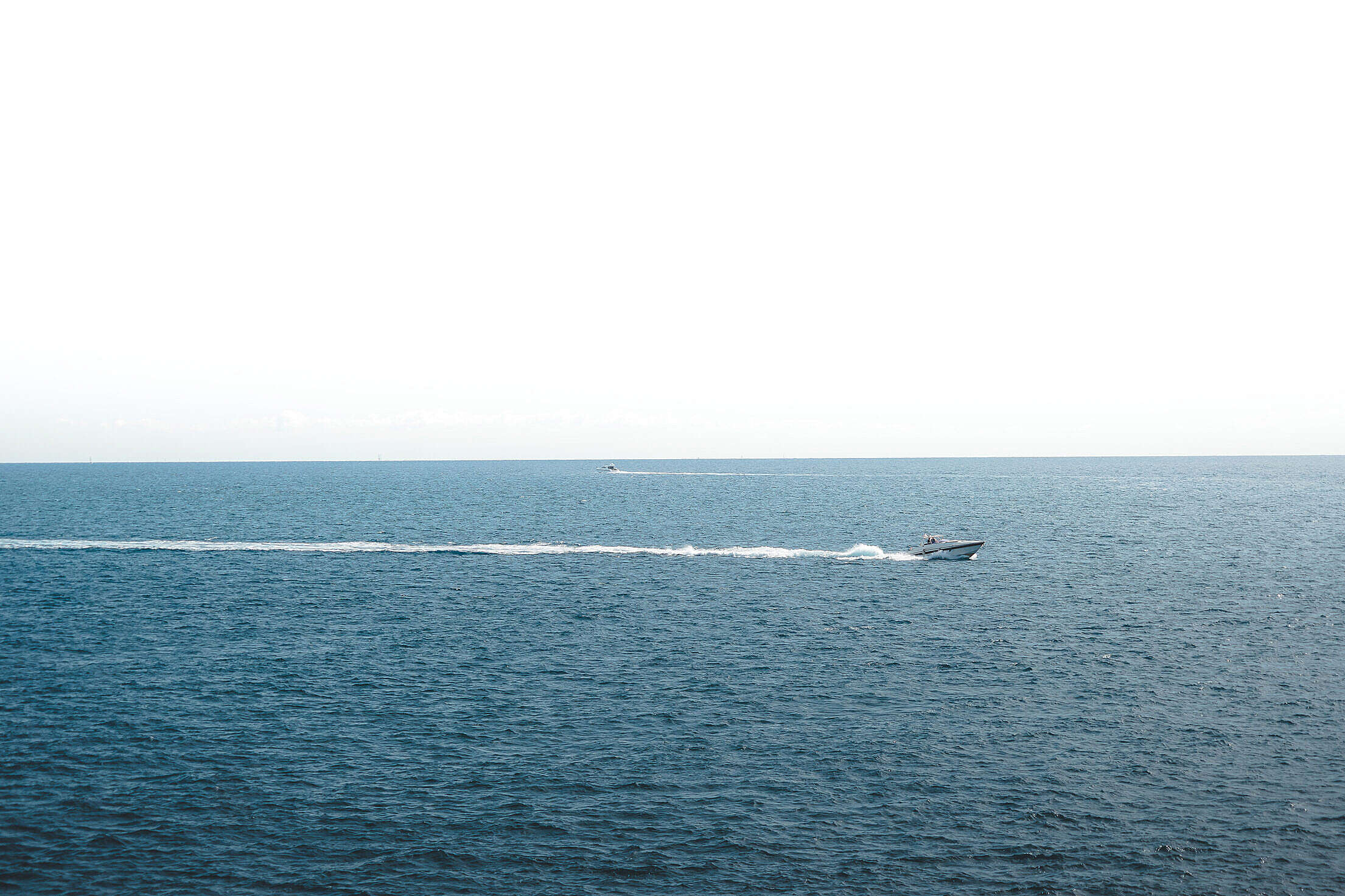 Boat at Sea Leaving a Wake Free Stock Photo | picjumbo