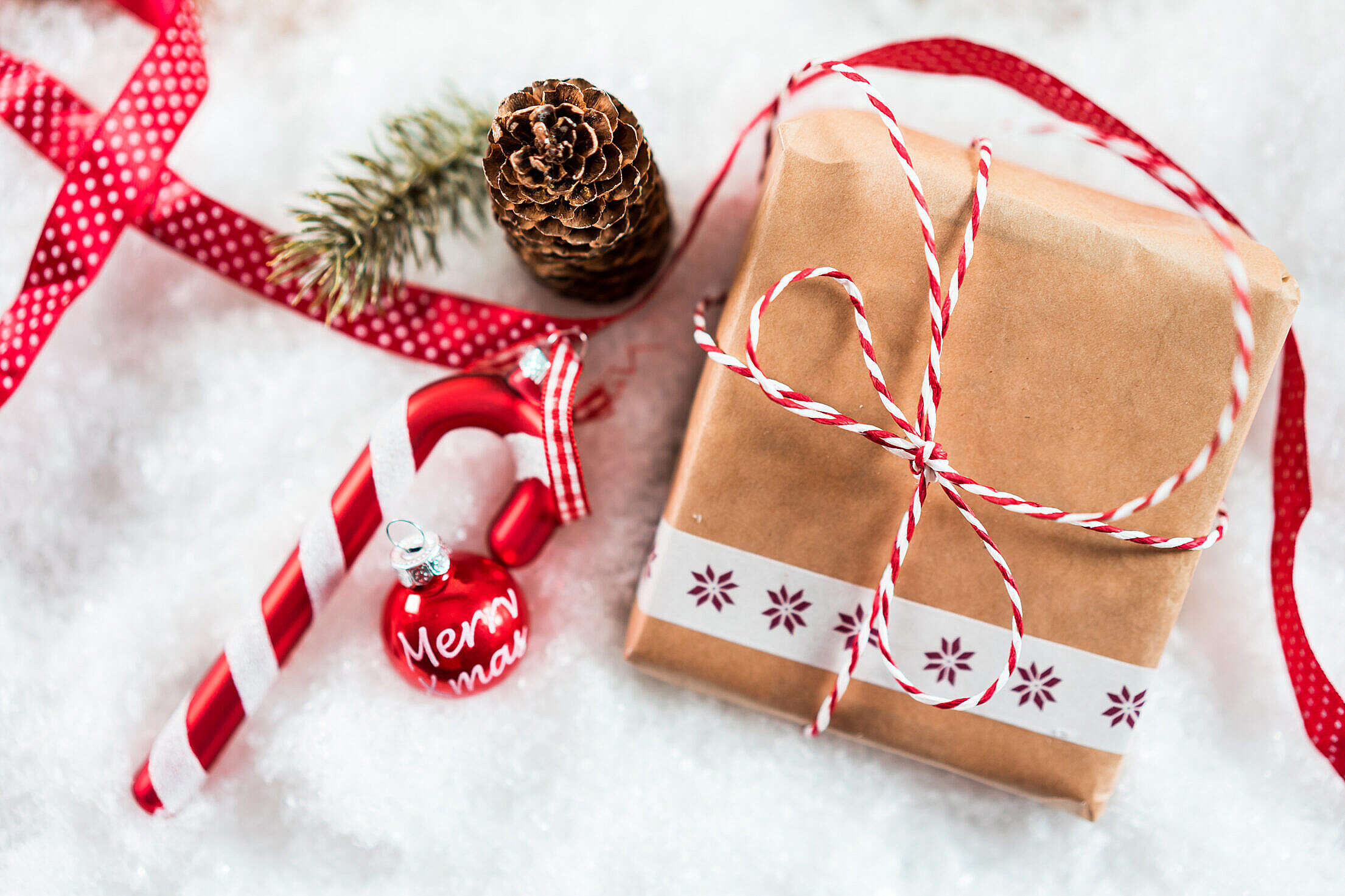 Christmas Present and Decorations in Snow Free Stock Photo | picjumbo