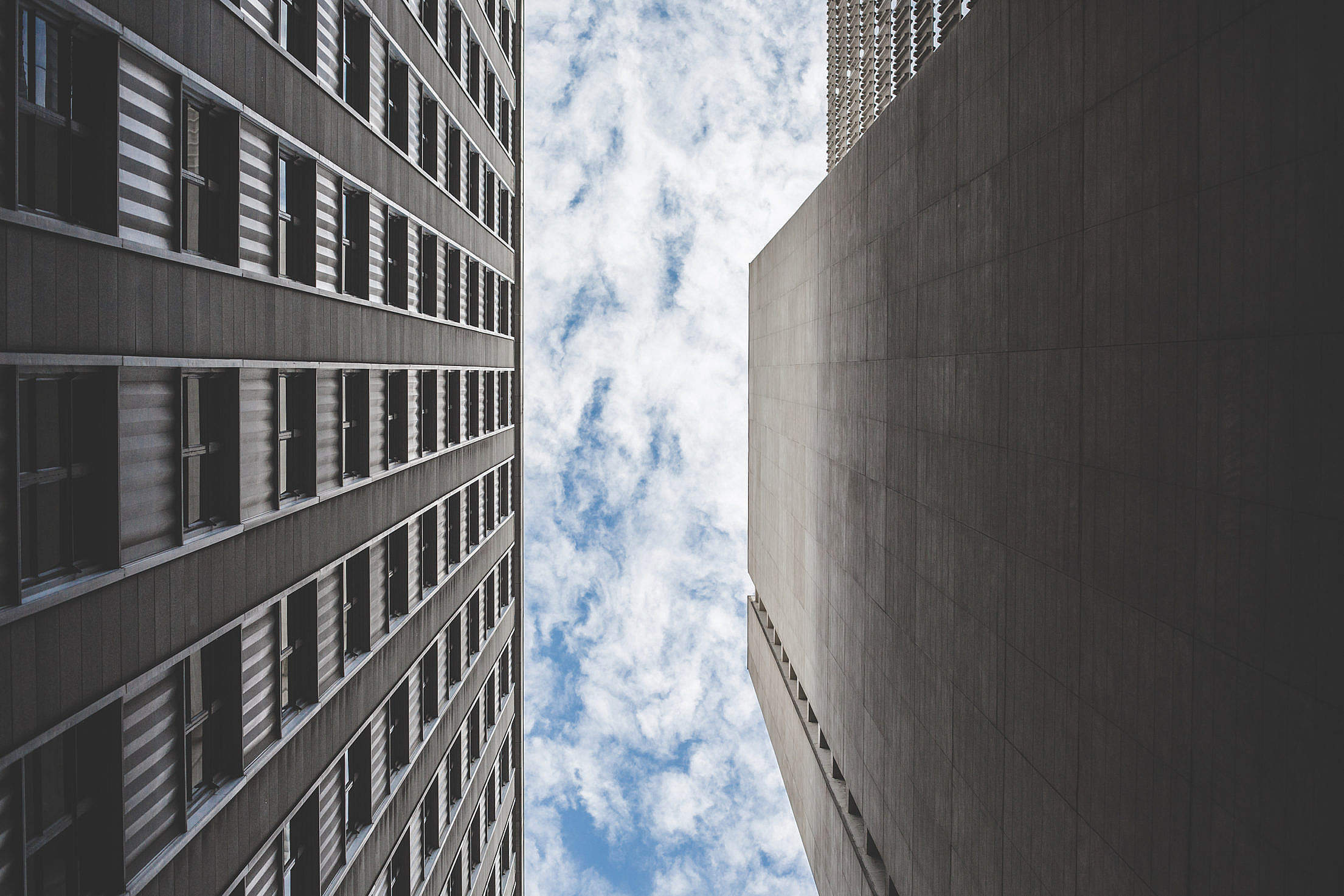 Cloudy Sky Between Two Skyscrapers Buildings Free Stock Photo | picjumbo