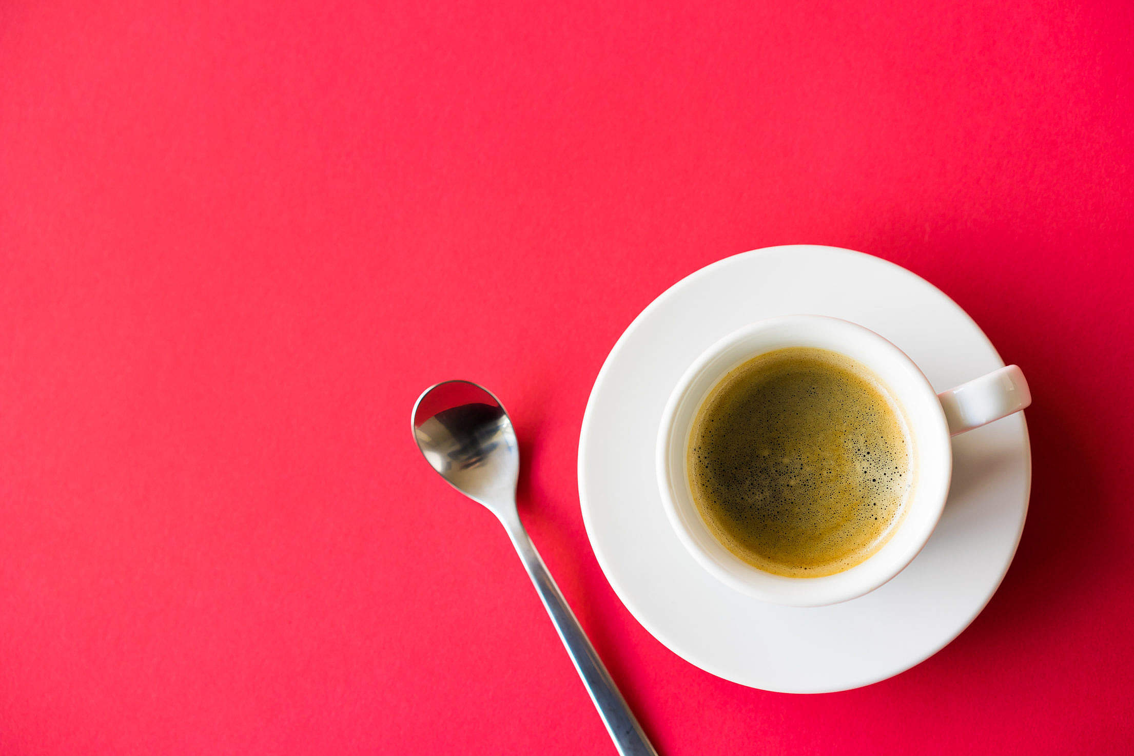Cup of Coffee on Red Background Space for Text Free Stock Photo | picjumbo