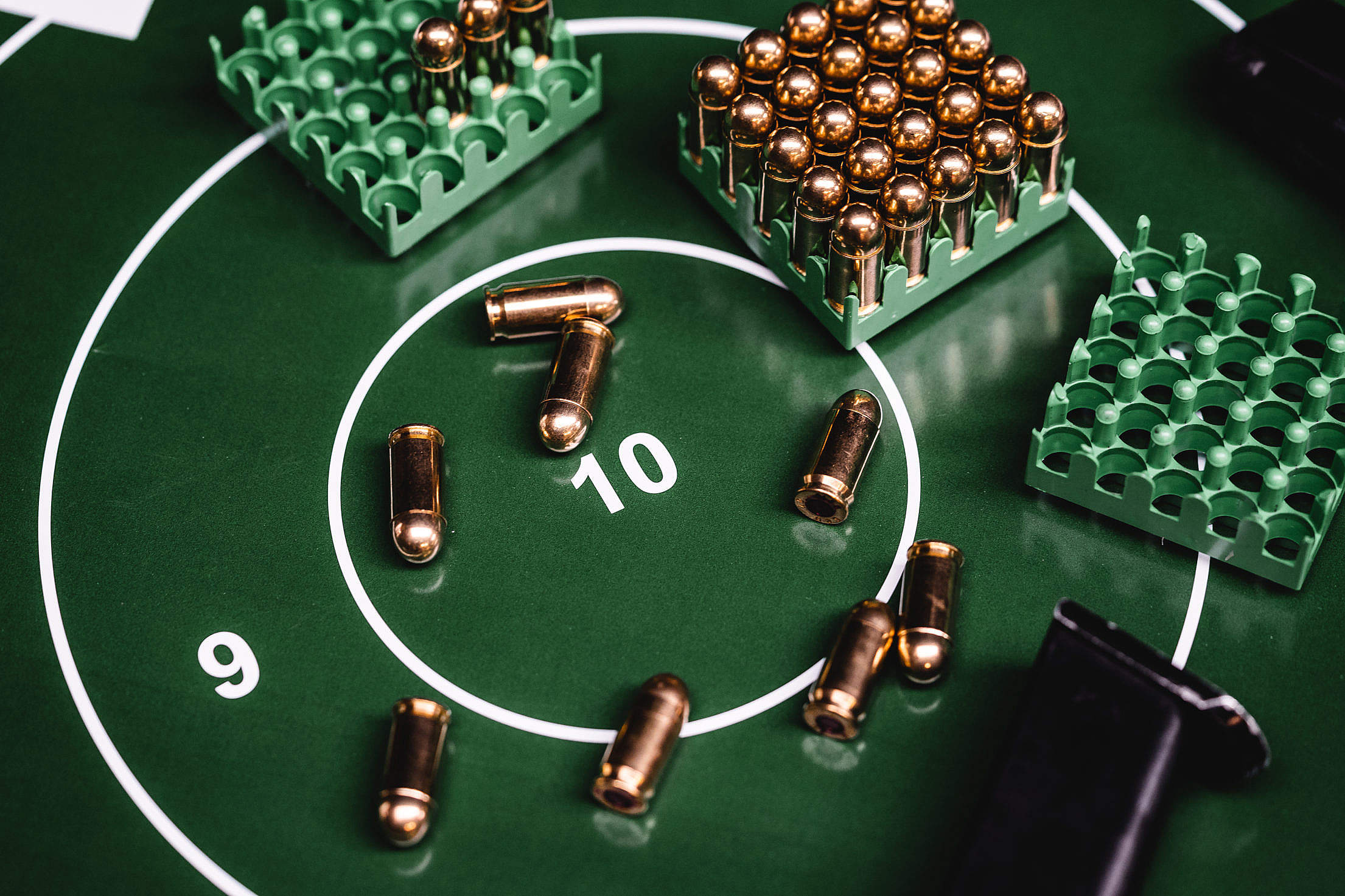 Green Shooting Target with a Lot of 9mm Ammunition Free Stock Photo ...