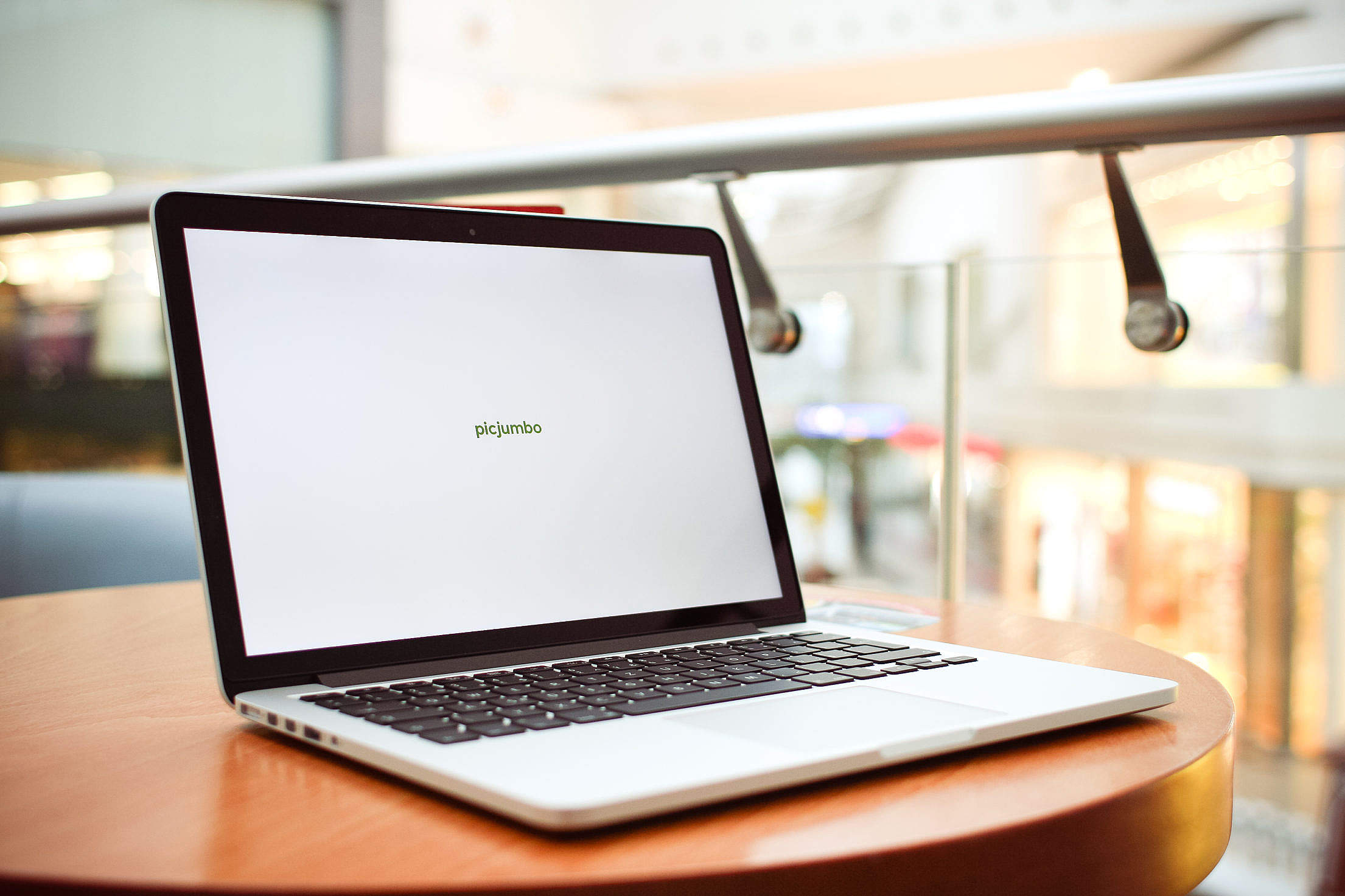 MacBook Laptop in Café Free Stock Photo | picjumbo
