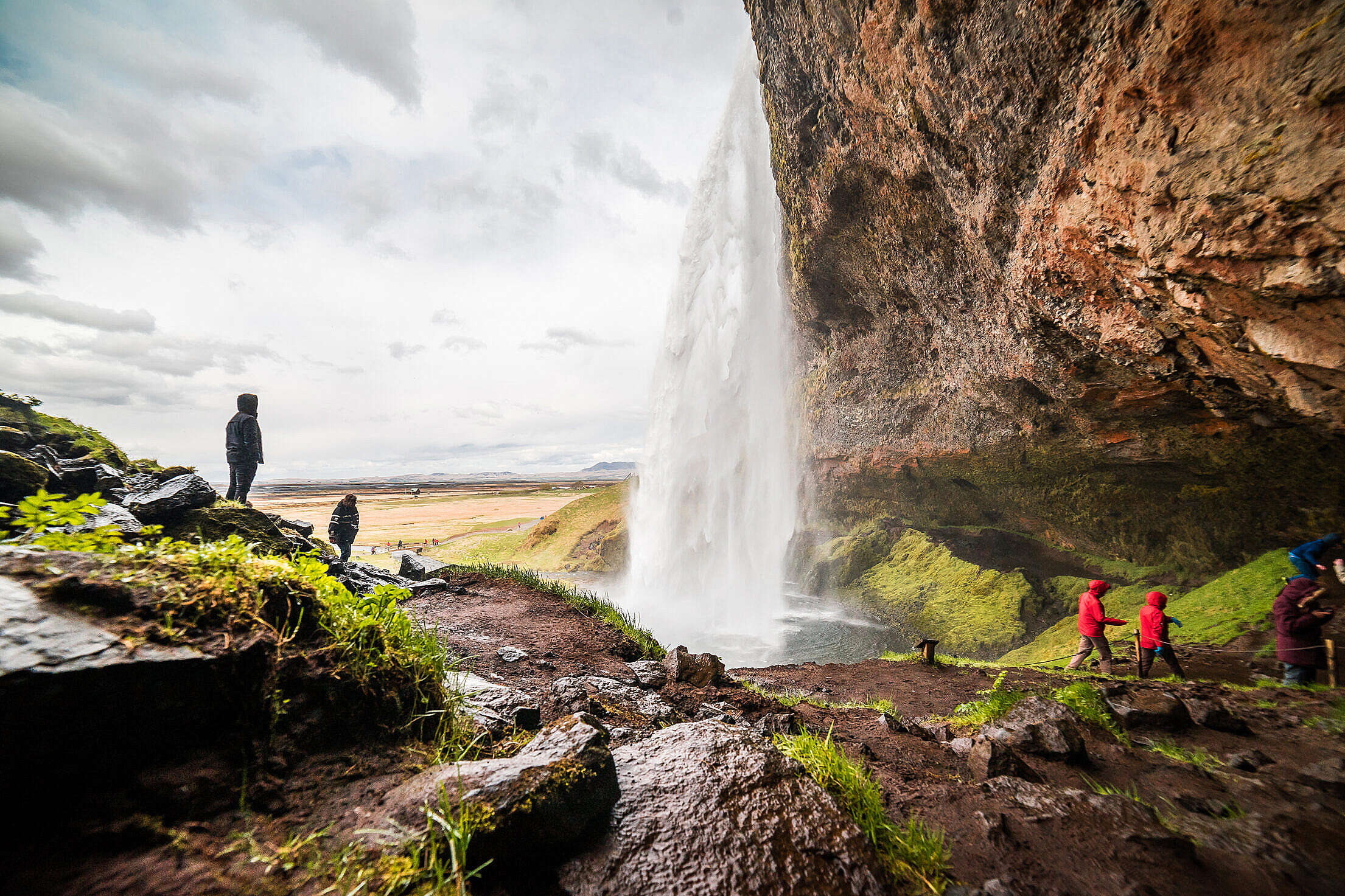 People Under Seljalandsfoss Waterfall in Iceland Free Stock Photo ...