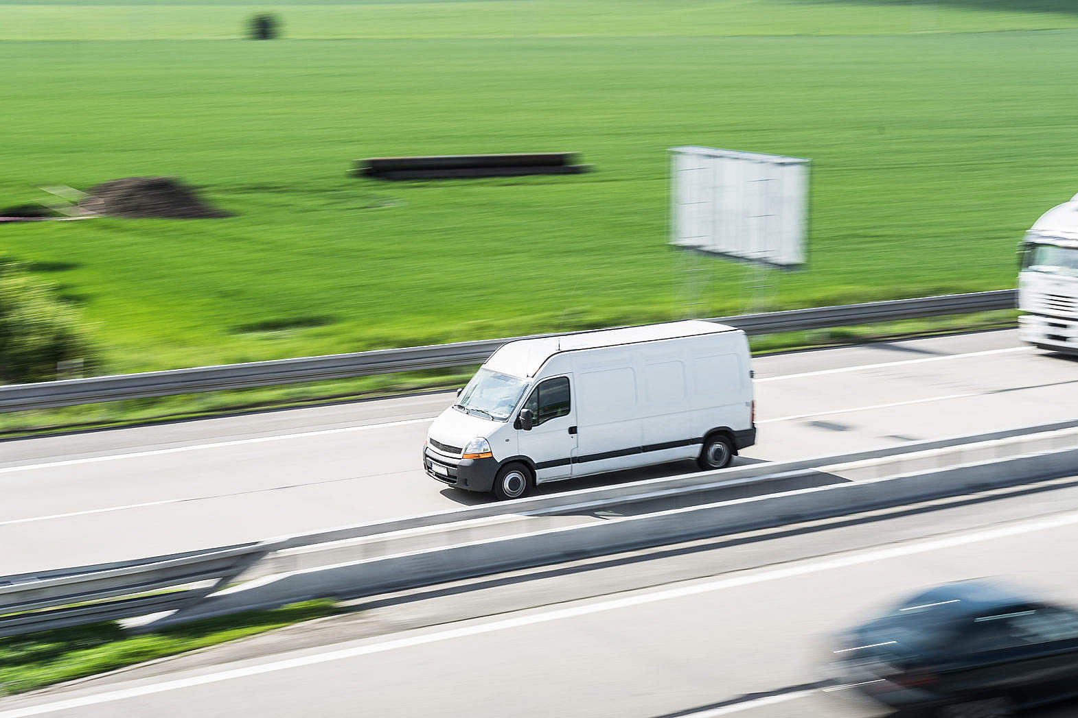 White Delivery Van in Motion Driving on Highway Free Stock Photo | picjumbo