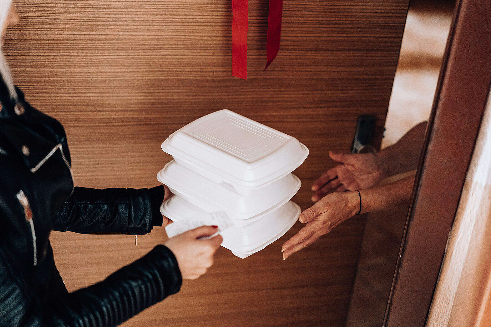 Woman Handing over Ordered Boxes with Food Free Stock Photo | picjumbo