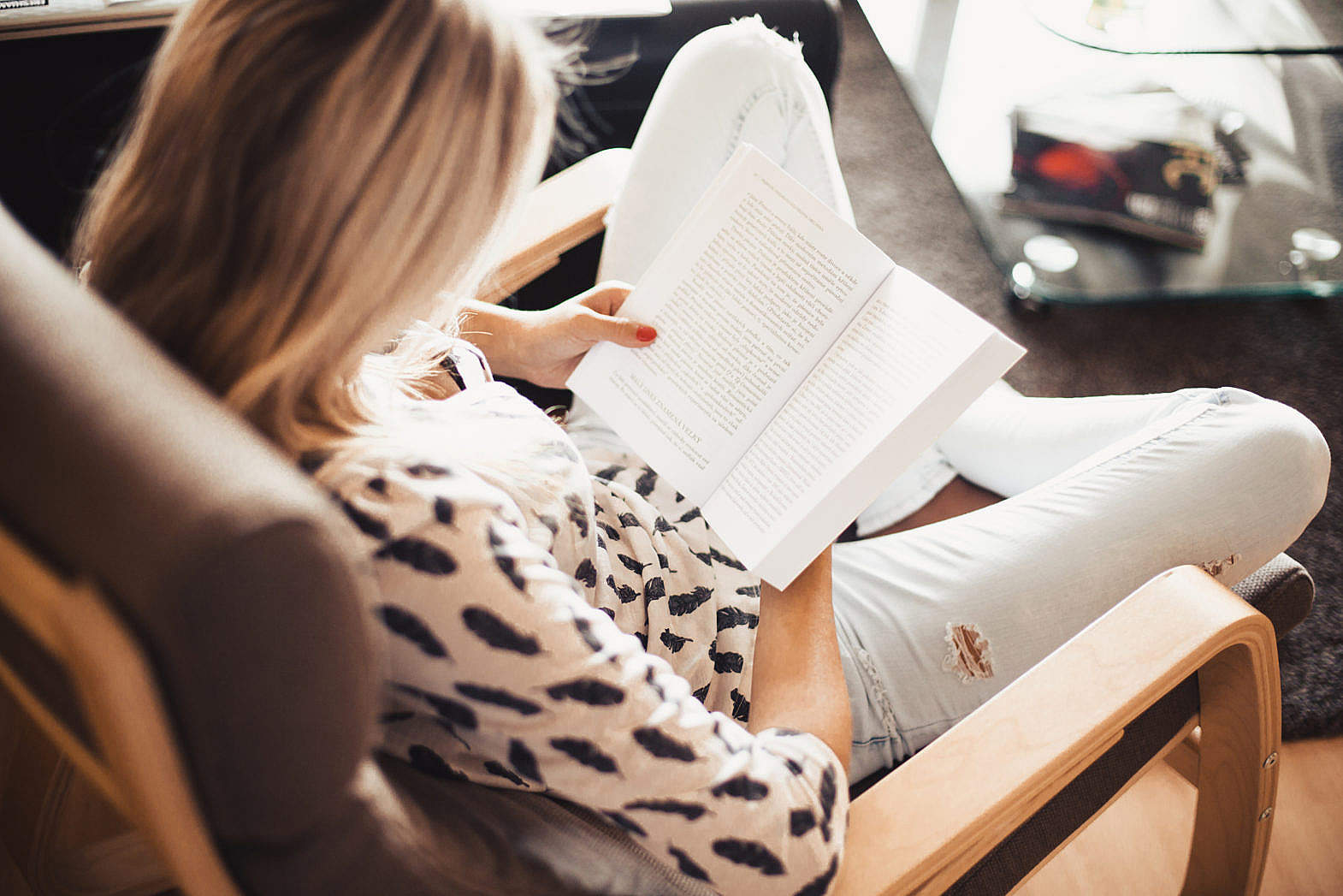 Woman Reading a Book in a Chair Free Stock Photo | picjumbo