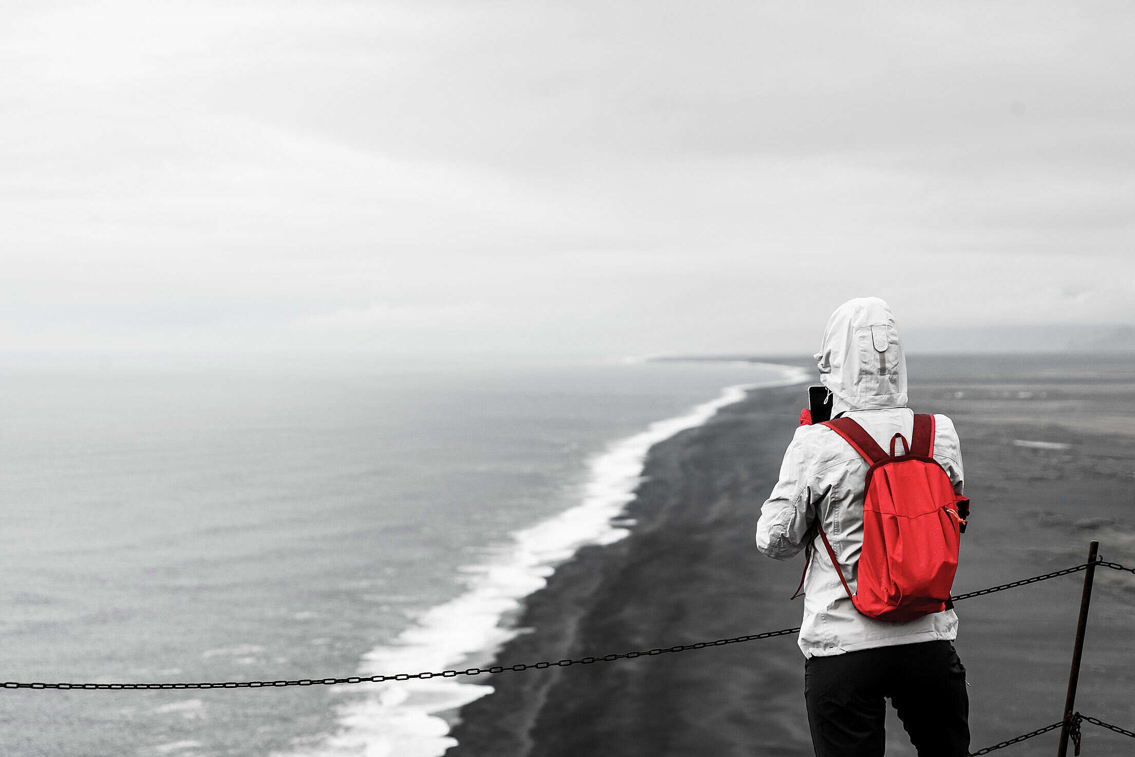 Woman Taking a Picture of a Black Beach in Iceland Free Stock Photo | picjumbo