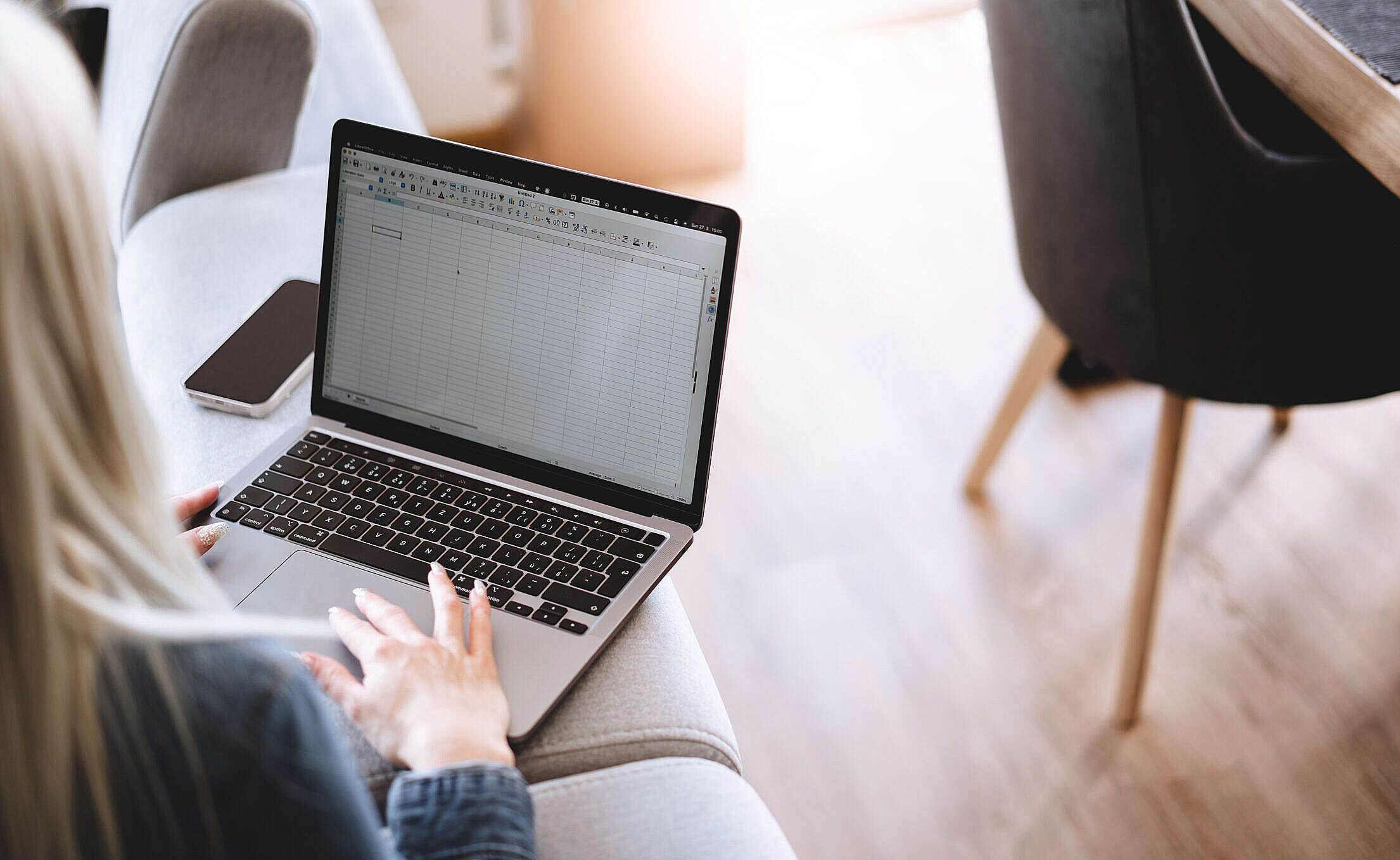 Woman Using Spreadsheet on Her Laptop at Home Free Stock Photo | picjumbo